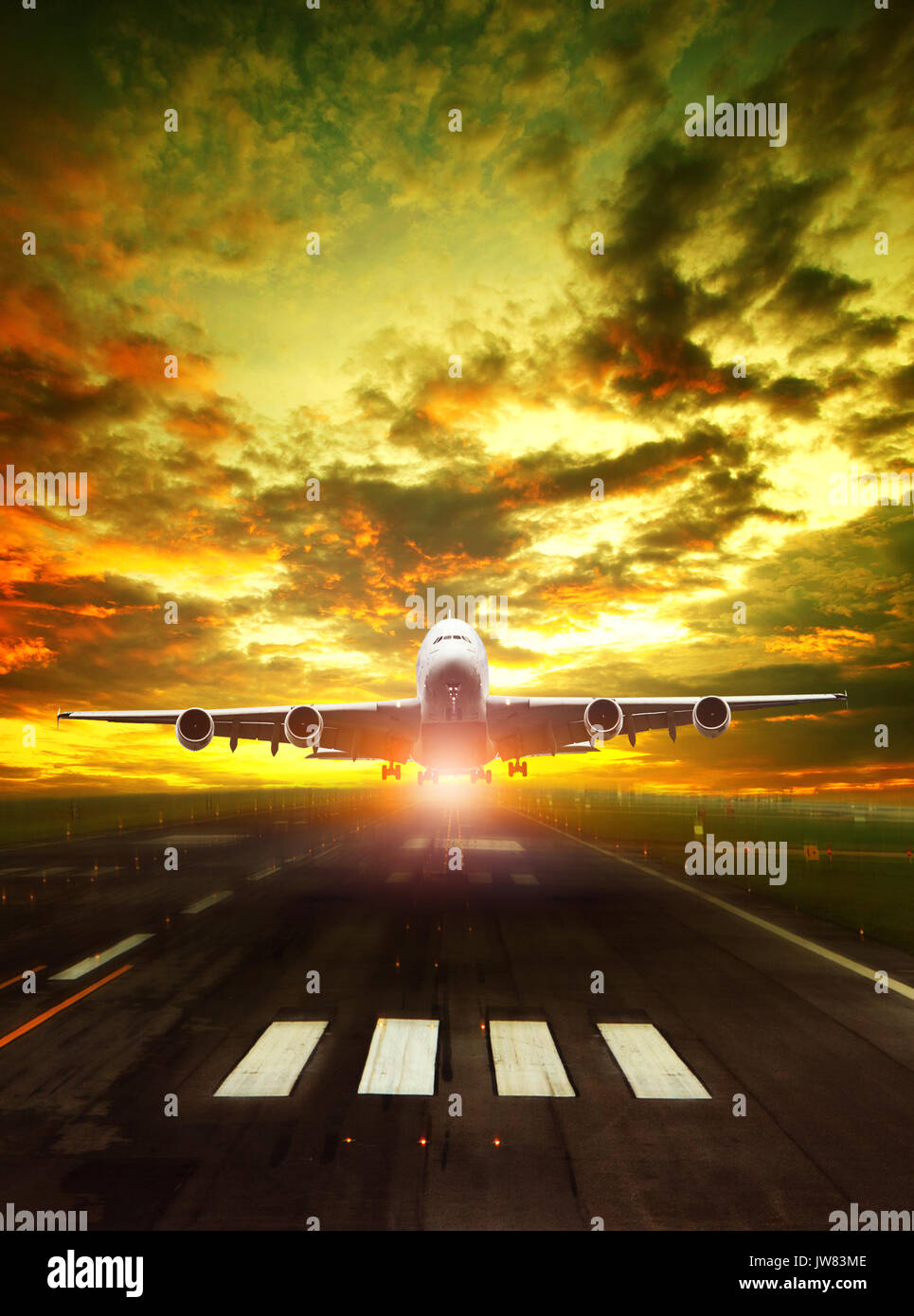 airliner plane take off from airport runway against beautiful sun ...