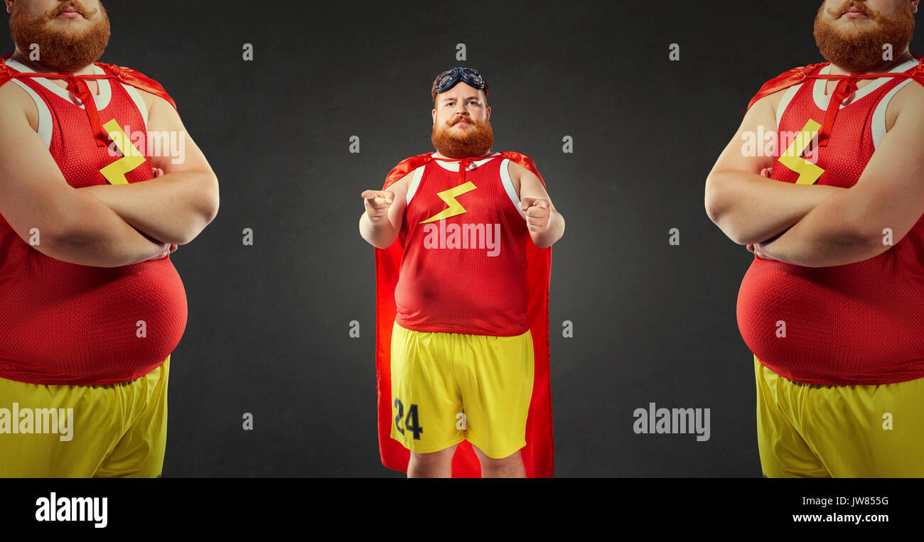 A fat funny man in a superhero costume points a hand at you Stock Photo ...