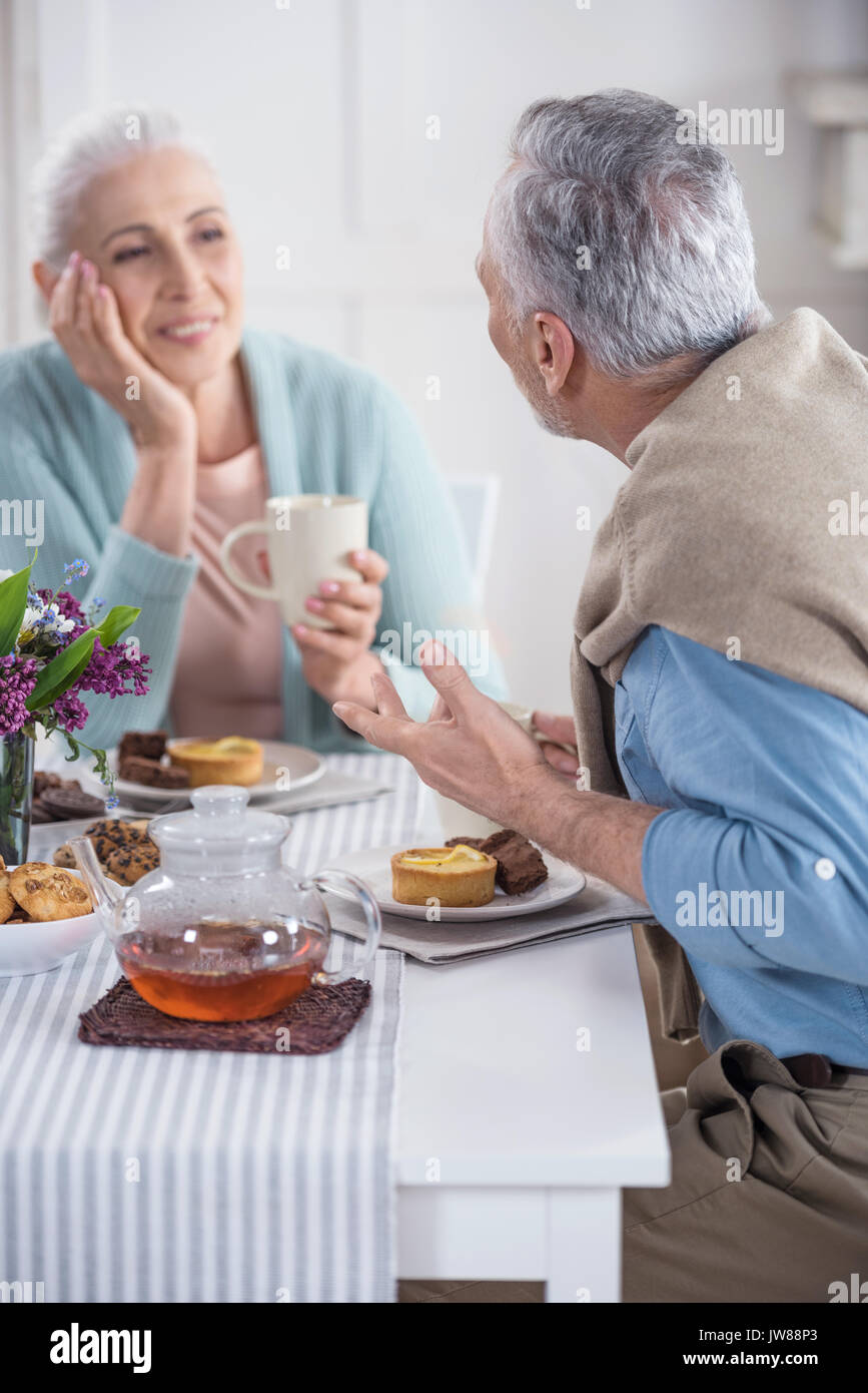 Senior caucasian couple having talking hi-res stock photography and ...