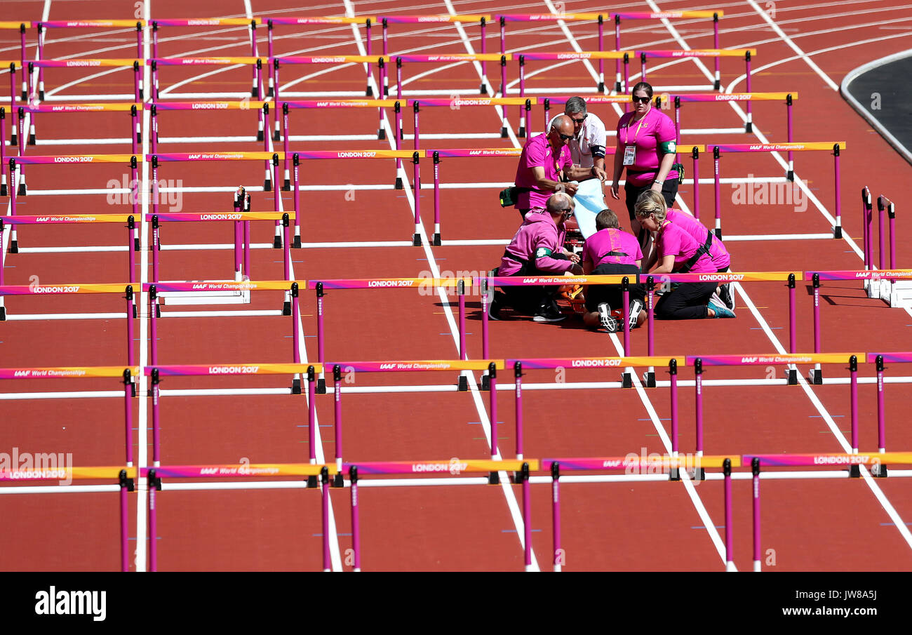 Trinidad and Tobago's Deboard John is attended to by staff following a ...