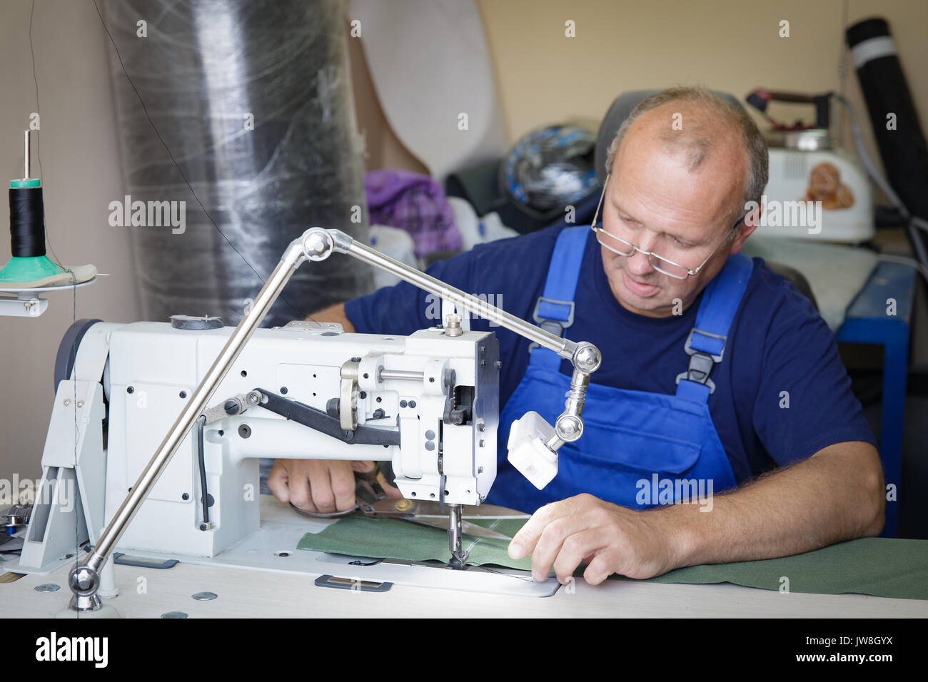 Tailor old man sewing hi-res stock photography and images - Alamy