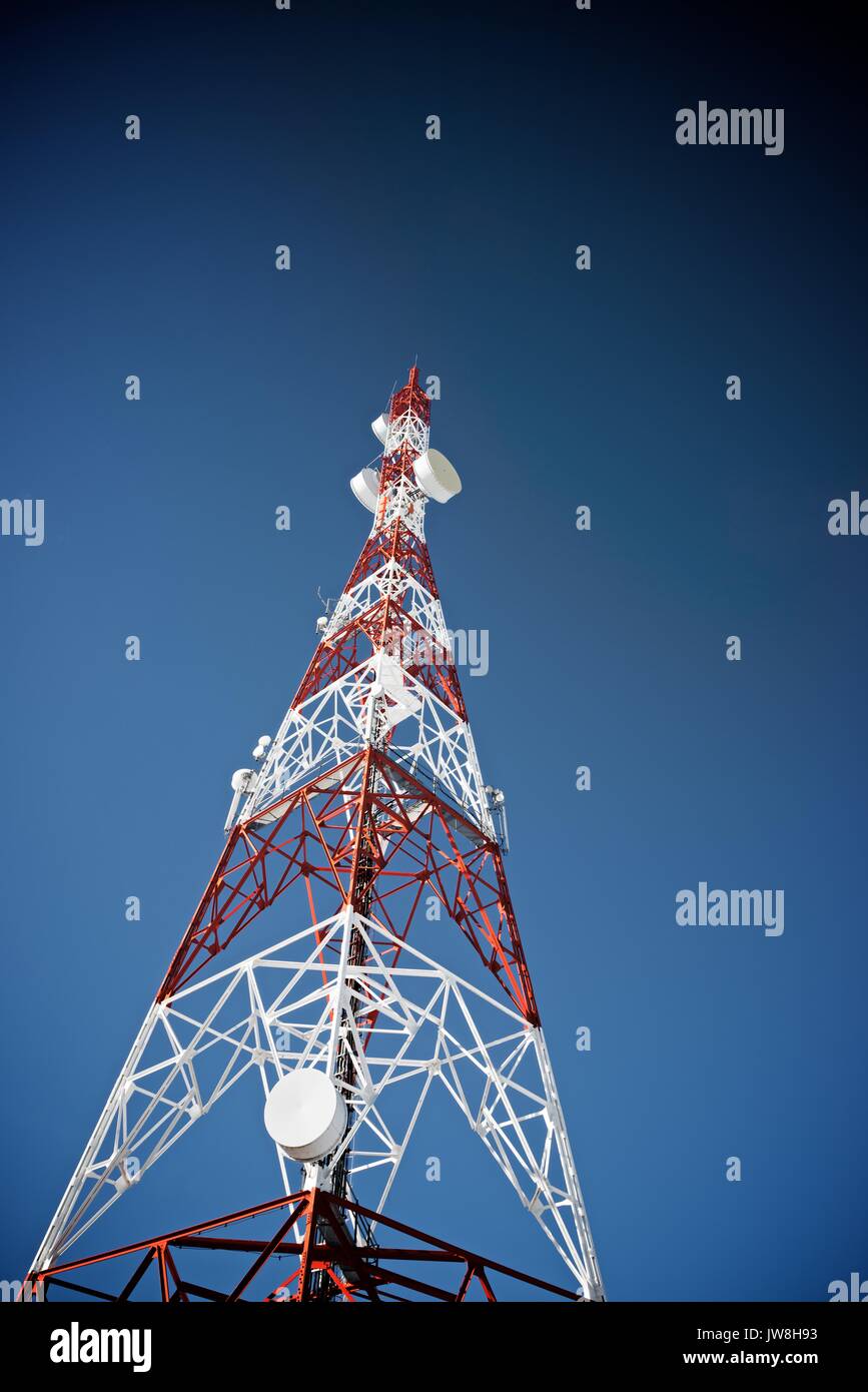 Telecommunications tower with clear blue sky Stock Photo - Alamy