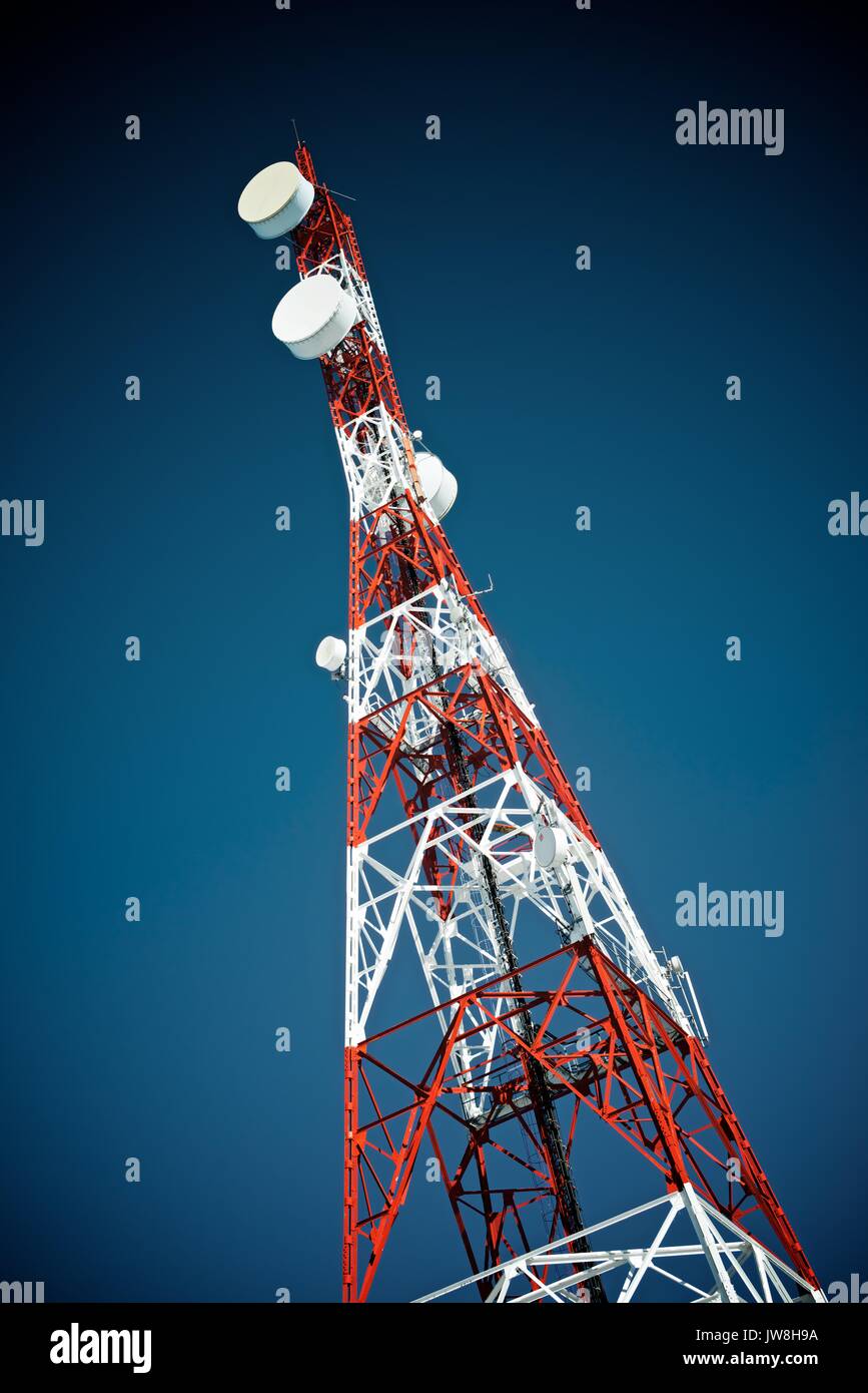 Telecommunications tower with clear blue sky Stock Photo - Alamy