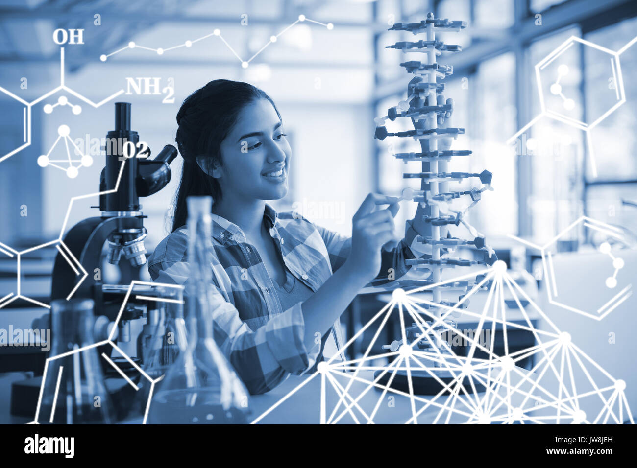 Kids doing a chemical experiment in laboratory against attentive ...