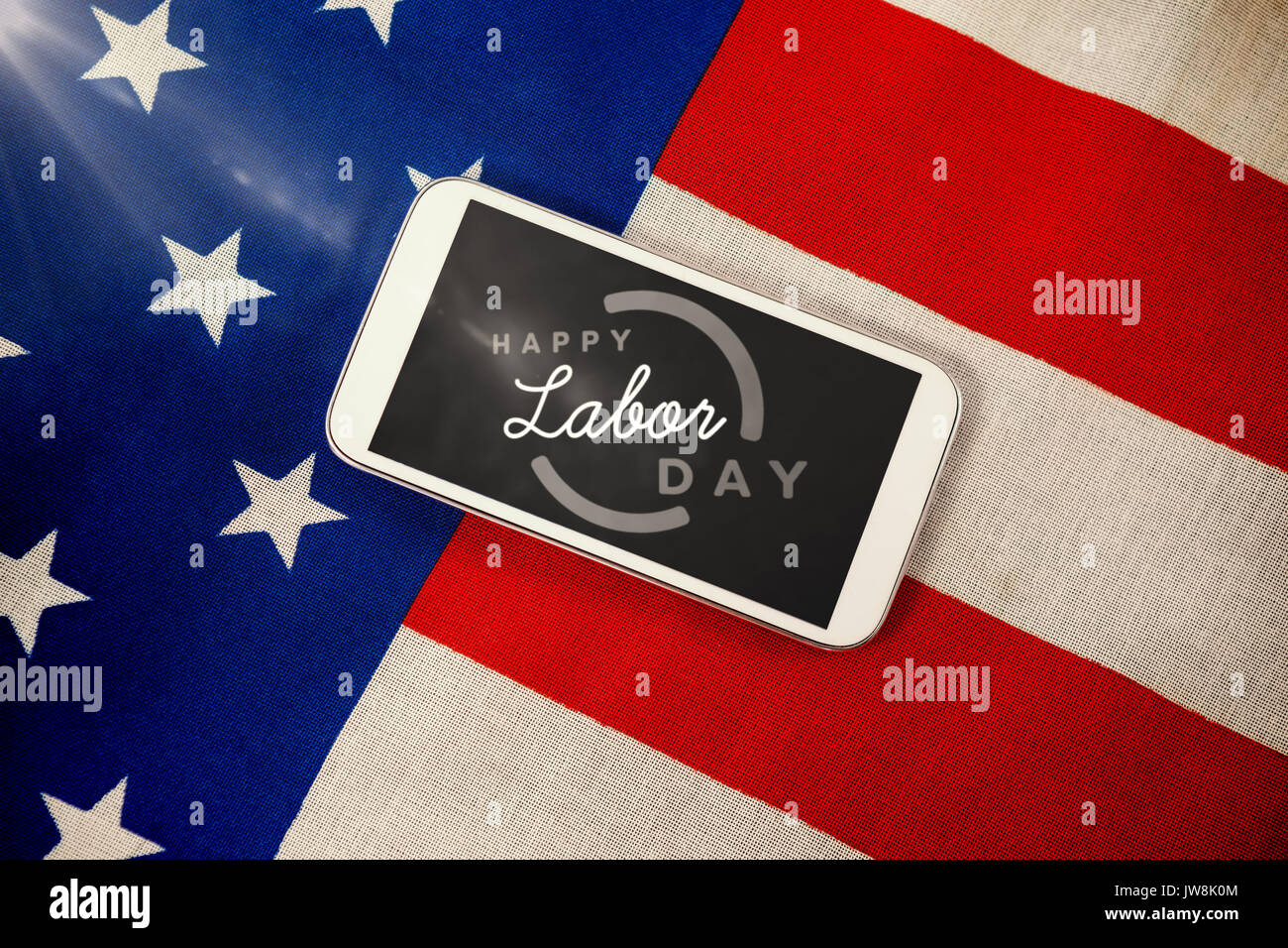 Flare against cellphone on american flag Stock Photo - Alamy