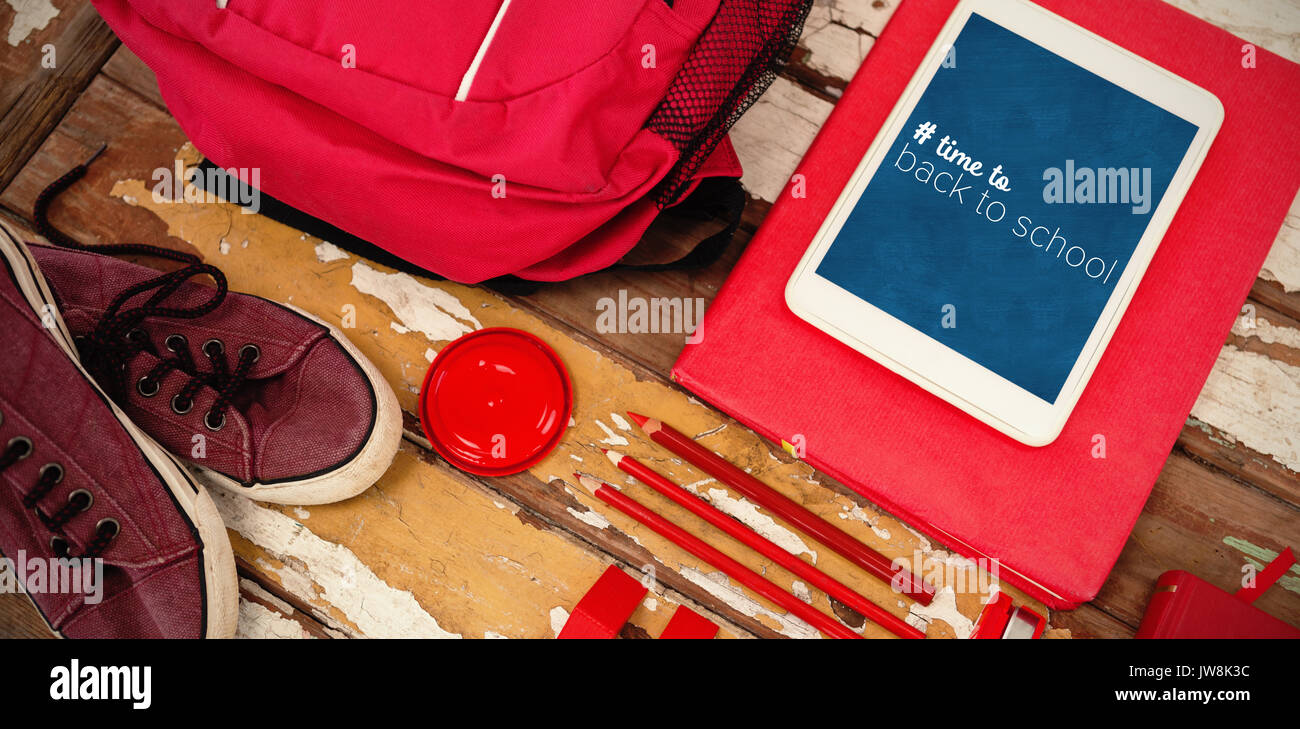 Back to school text with hashtag against high angle view of bag with ...