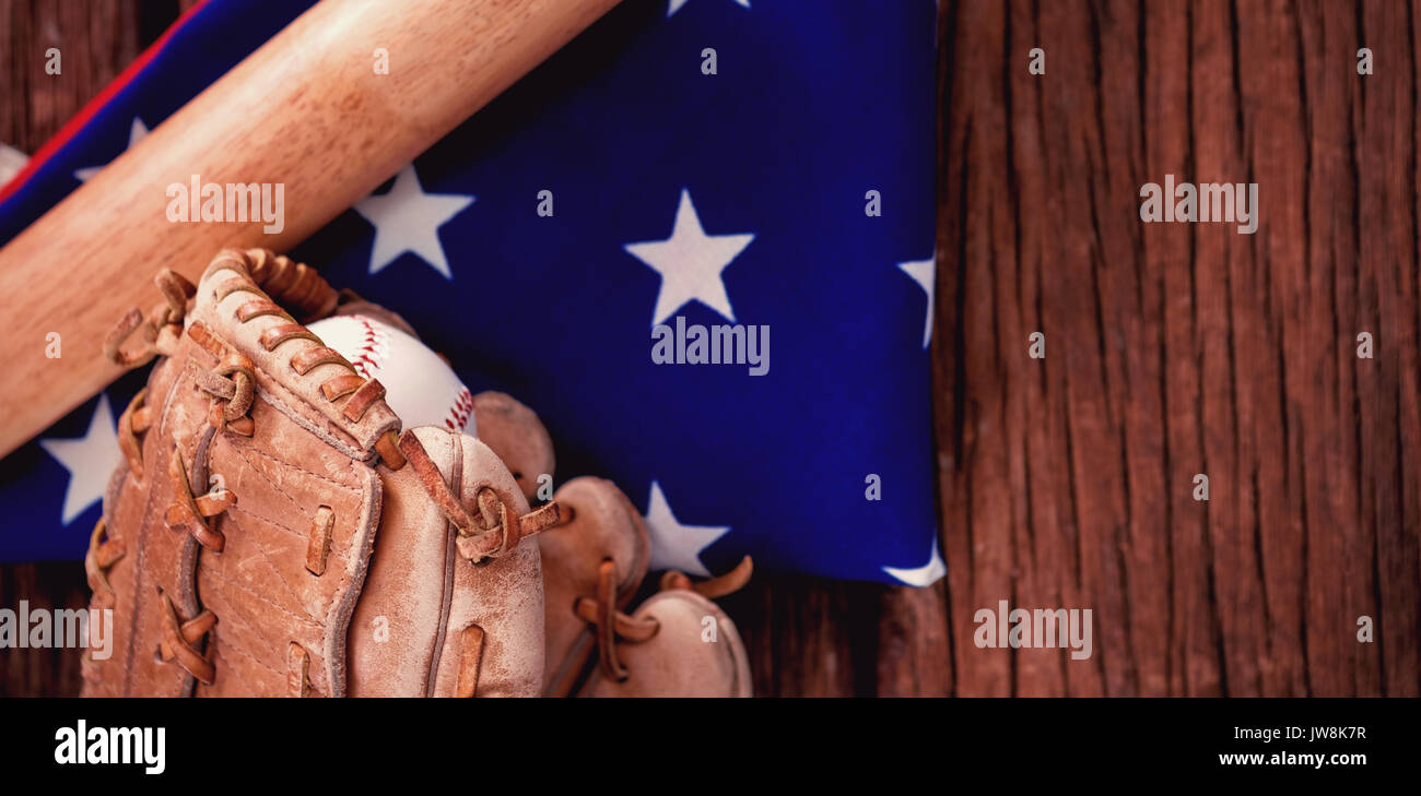 Close-up of baseball bat and gloves on American flag Stock Photo - Alamy