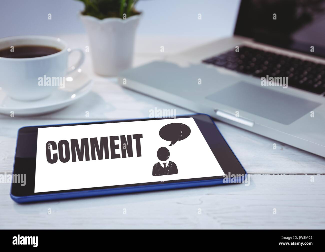 Digital composite of Comment text and chat graphic on tablet screen ...