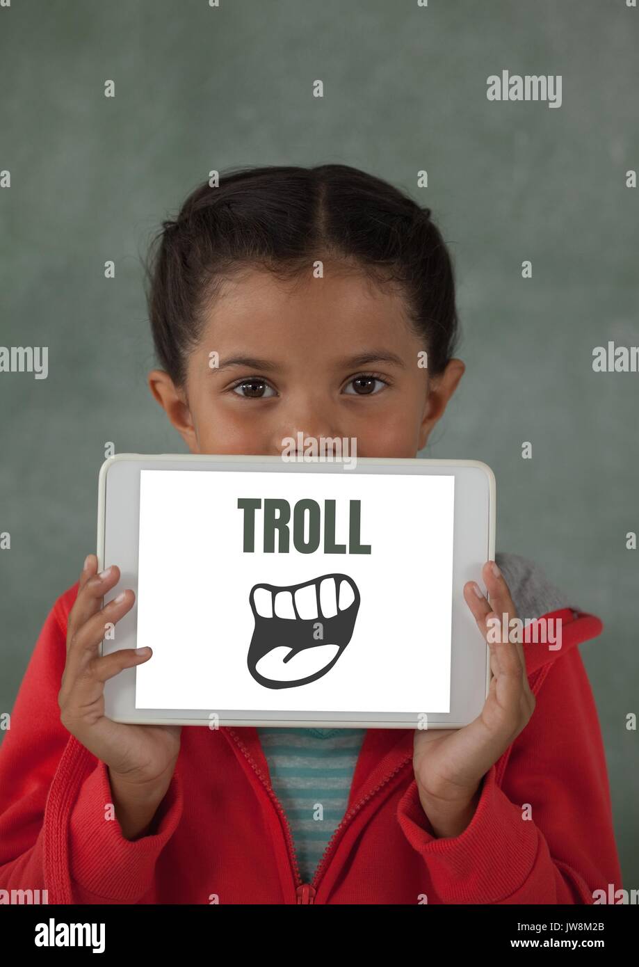 Digital composite of Troll text with cartoon mouth on tablet over girls ...