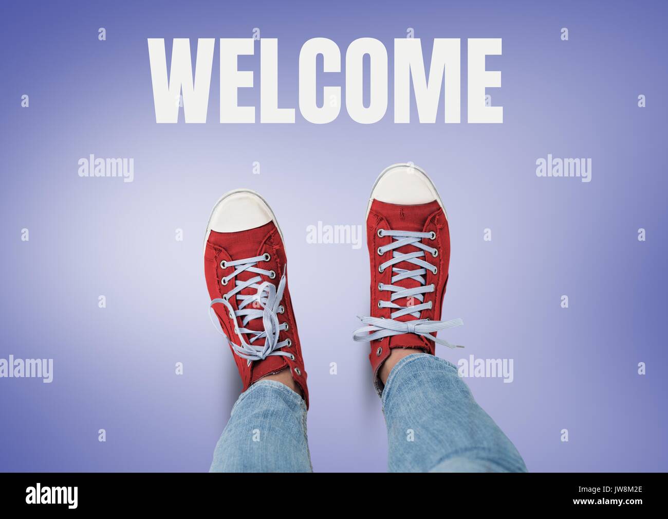 Digital composite of Welcome text and Red shoes on feet with purple ...