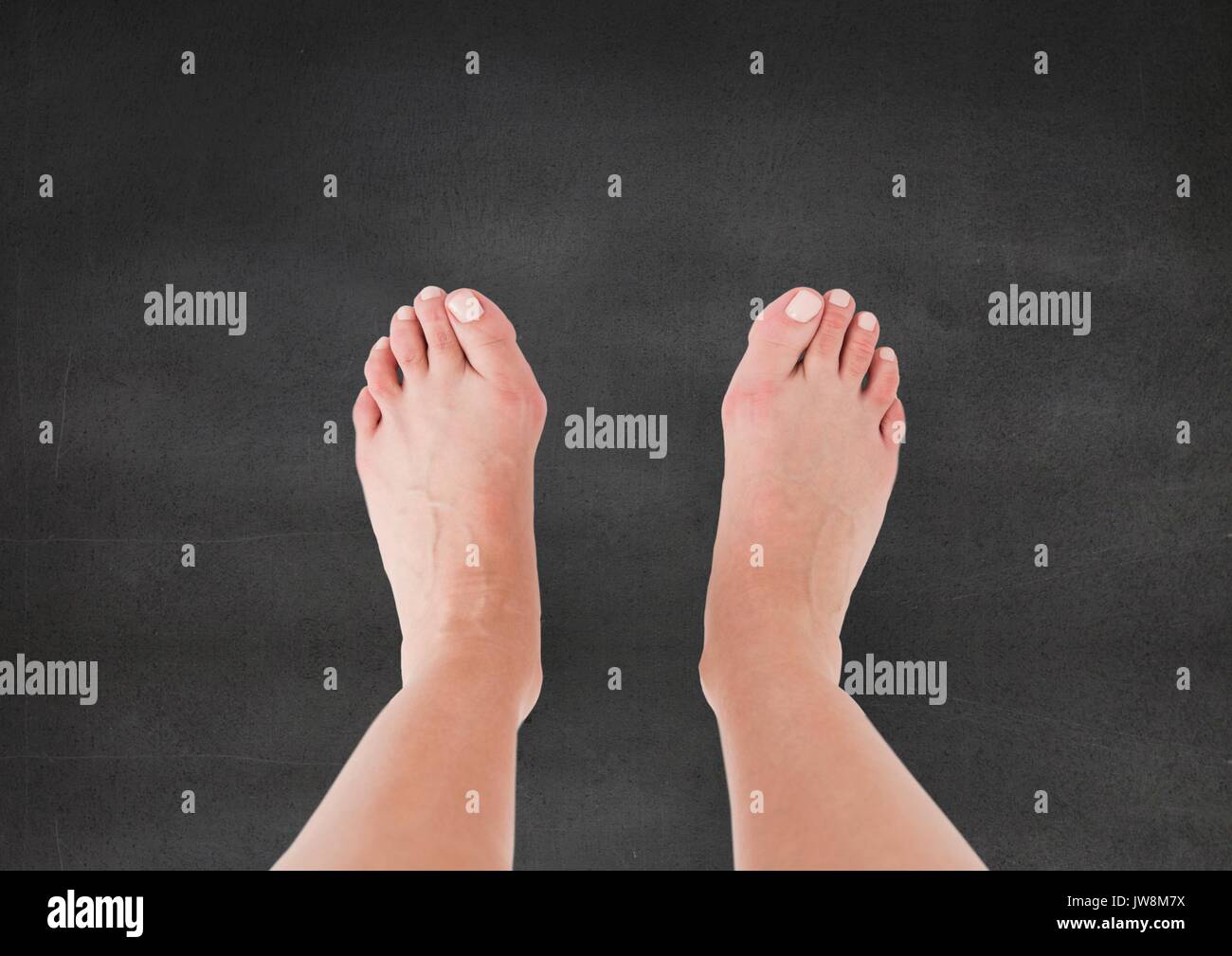 Digital composite of Bare feet and grey stone background Stock Photo ...