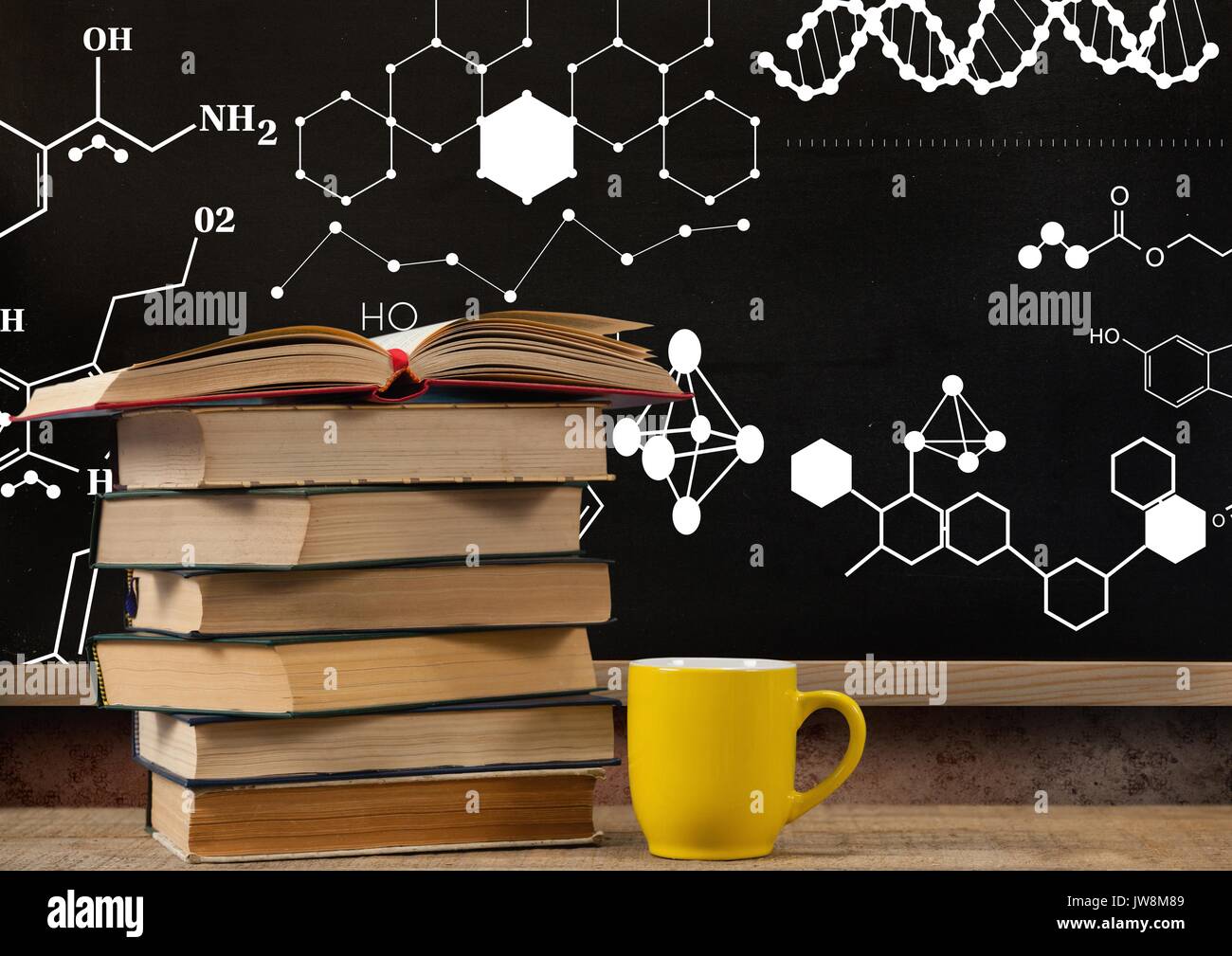 Digital composite of Books on Desk foreground with blackboard graphics ...