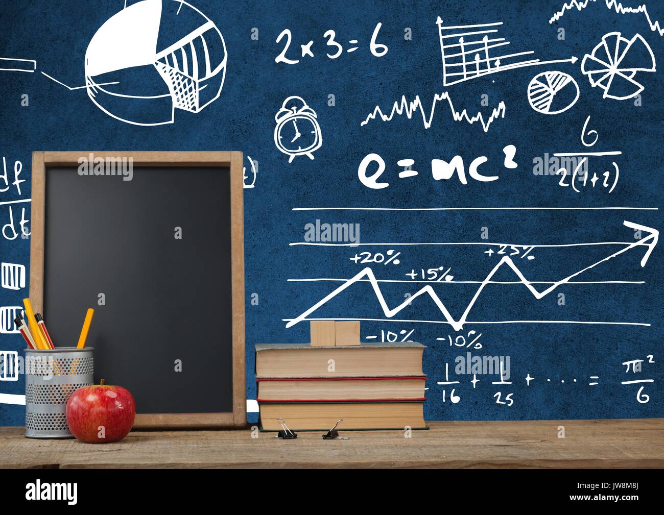 Digital composite of Desk foreground with blackboard graphics of math ...