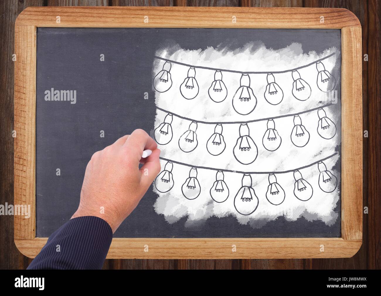 Digital composite of Hand drawing light bulbs on blackboard Stock Photo ...