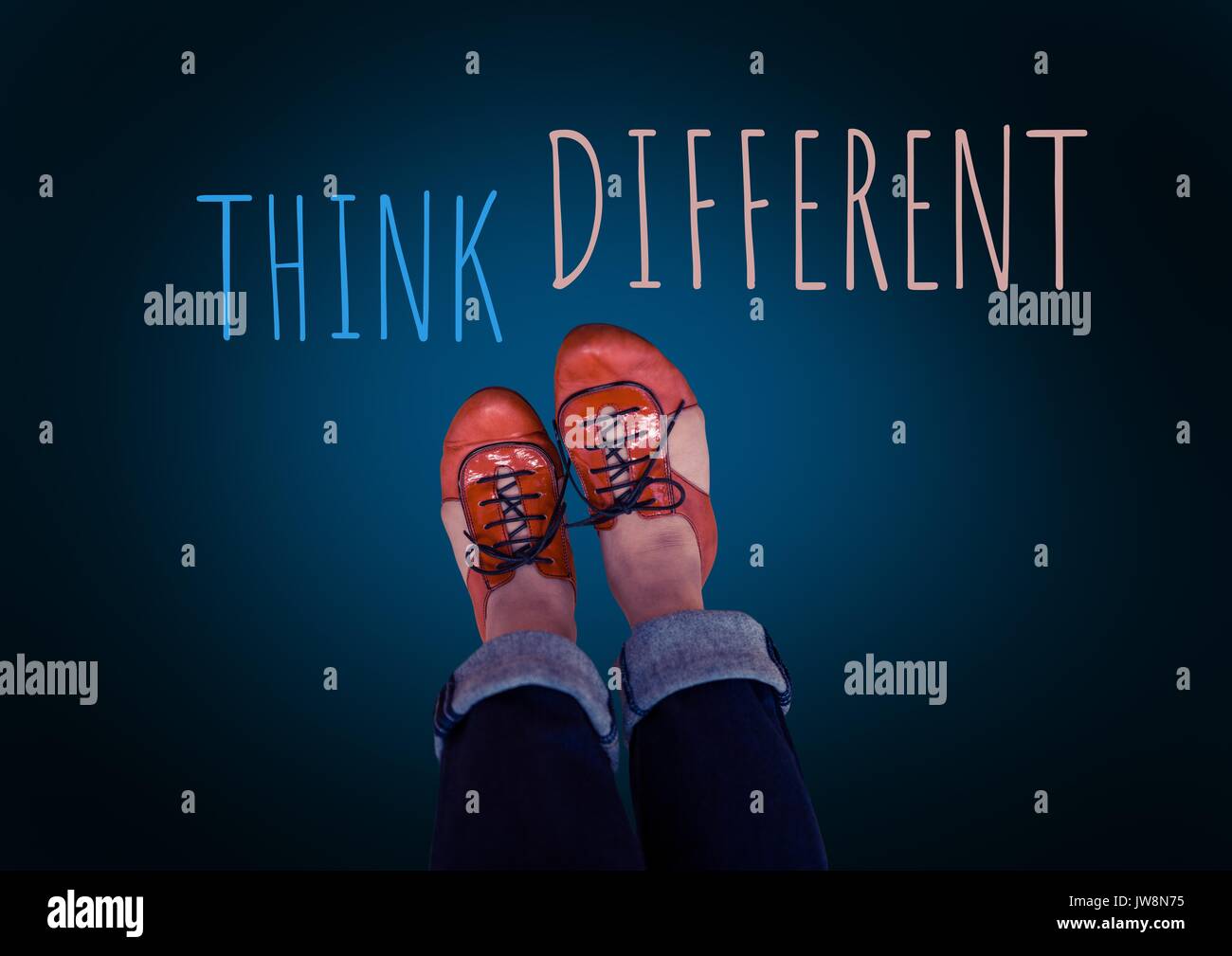 Digital composite of Think Different text and red shoes on feet with ...