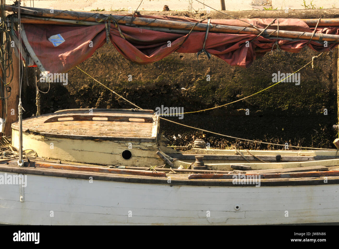 an old traditional sailing boat in a poor state of repair with a ...