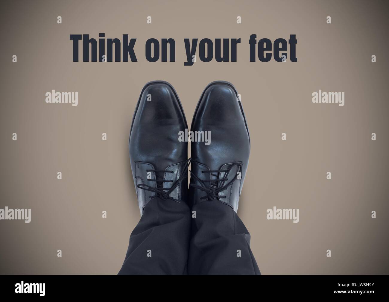 Digital composite of Think on your feet text and Black shoes on feet ...