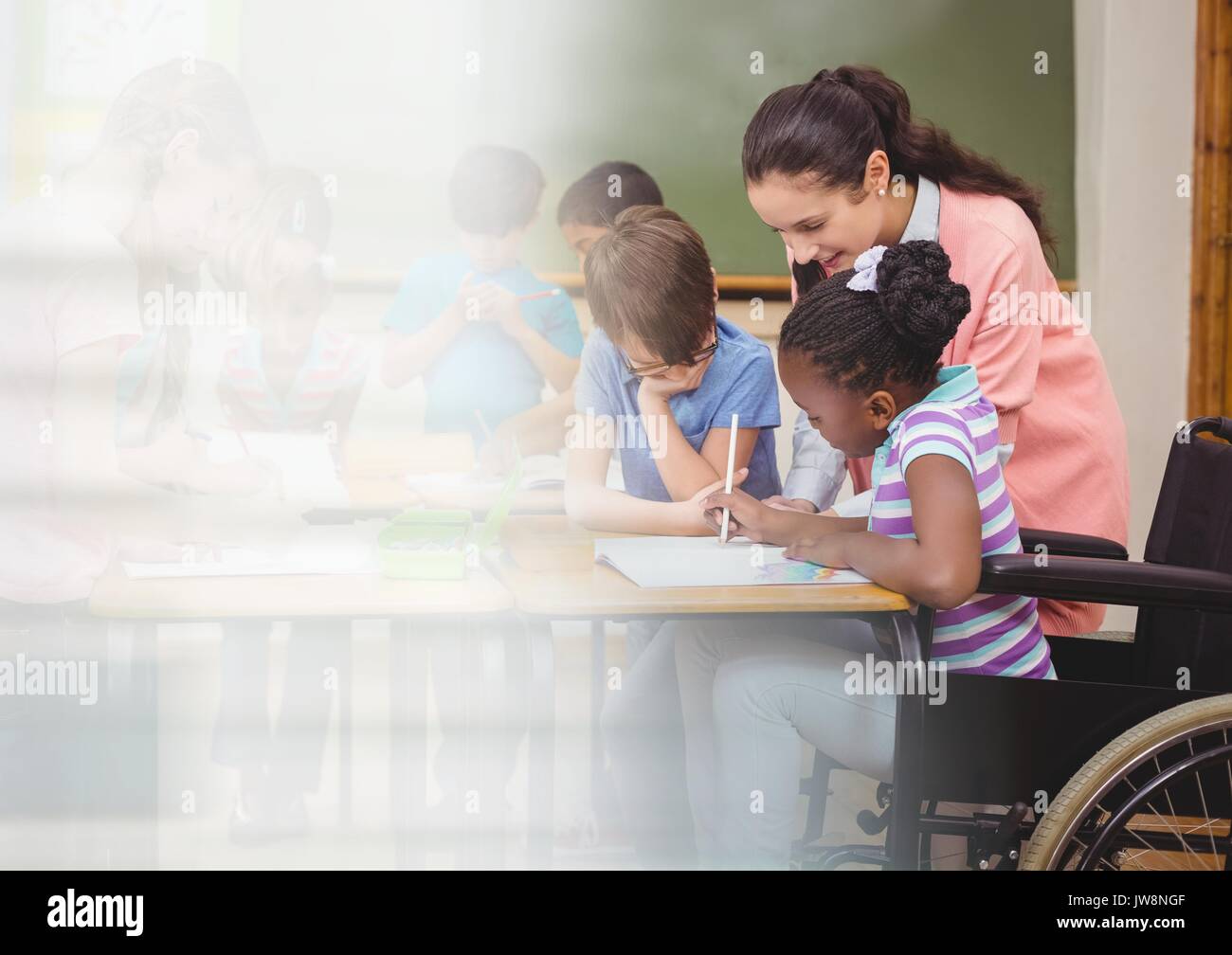 Digital composite of Elementary school teacher with class and disabled ...