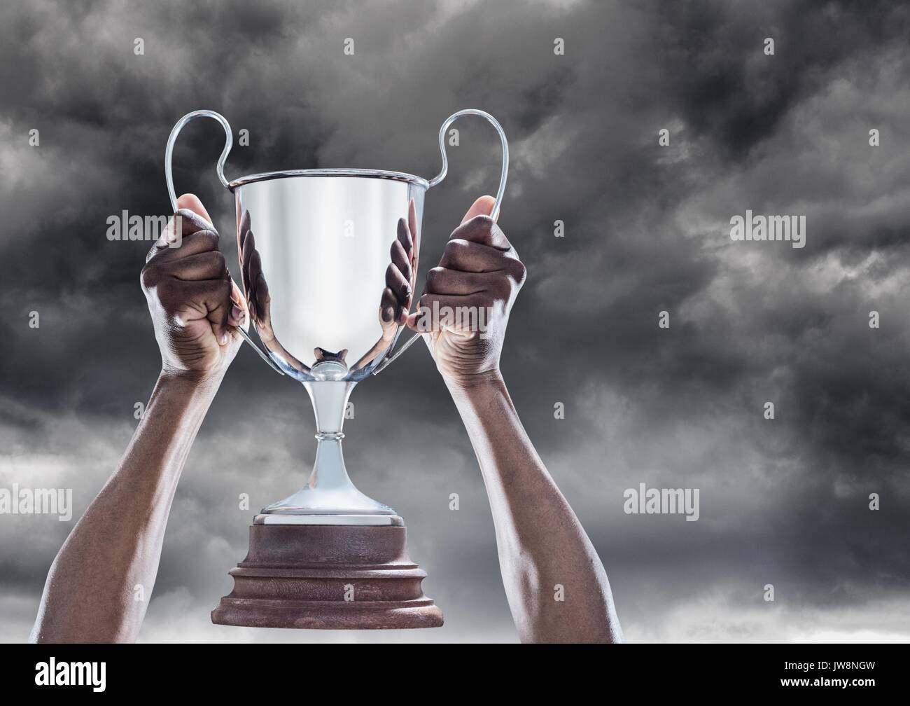 Digital composite of Man with a trophy on hands Stock Photo - Alamy