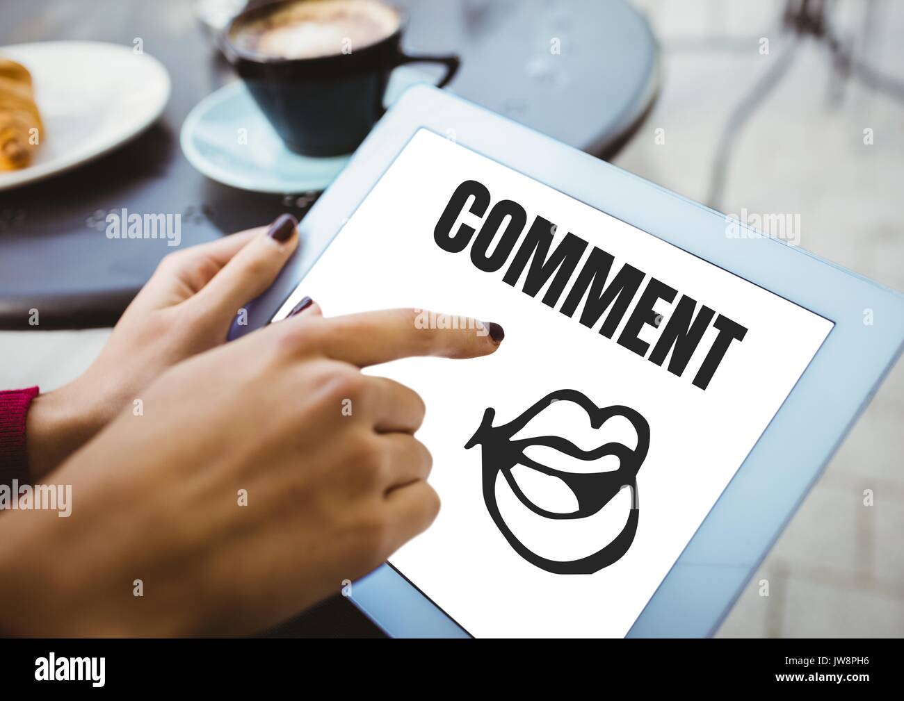 Digital composite of Comment text and mouth graphic on tablet screen ...