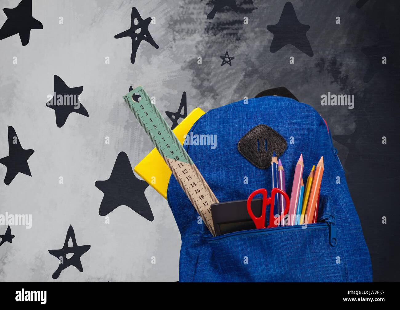 Digital composite of Schoolbag on Desk foreground with blackboard ...