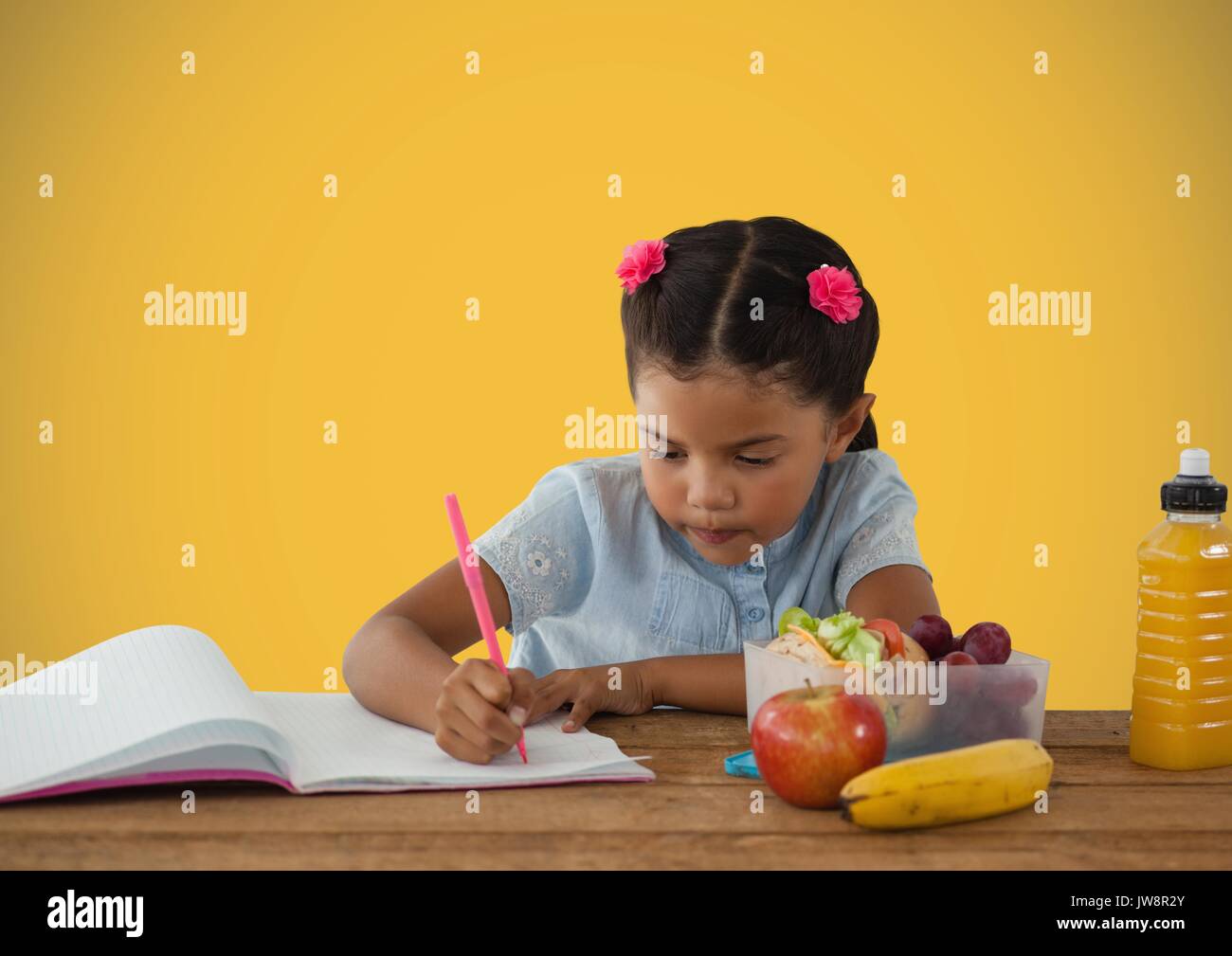 Digital composite of Schoolgirl writing with healthy lunch Stock Photo ...