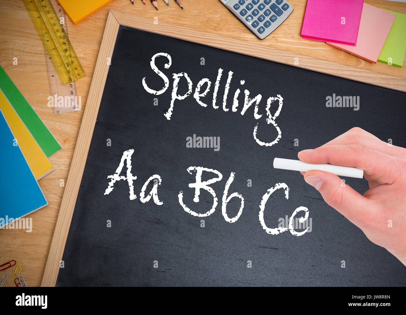 Digital composite of Hand writing Spelling text on blackboard Stock ...