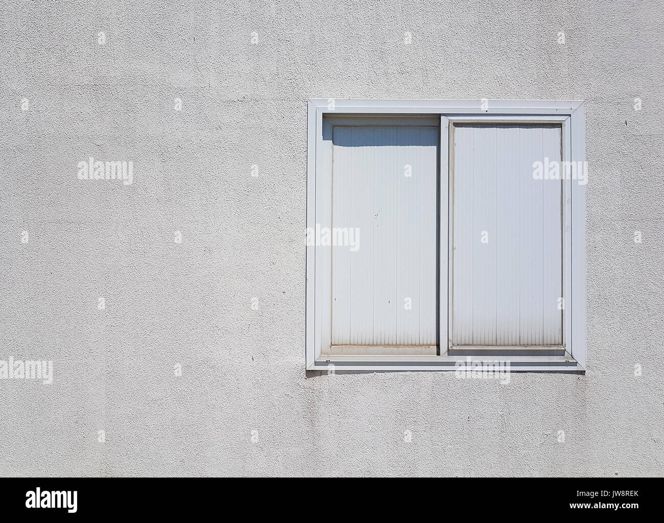 white plastic window on rough white concrete wall Stock Photo - Alamy