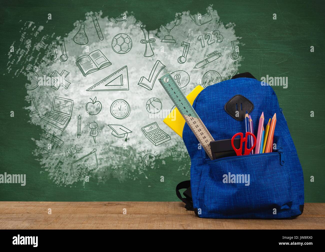 Digital composite of Schoolbag on Desk foreground with blackboard ...