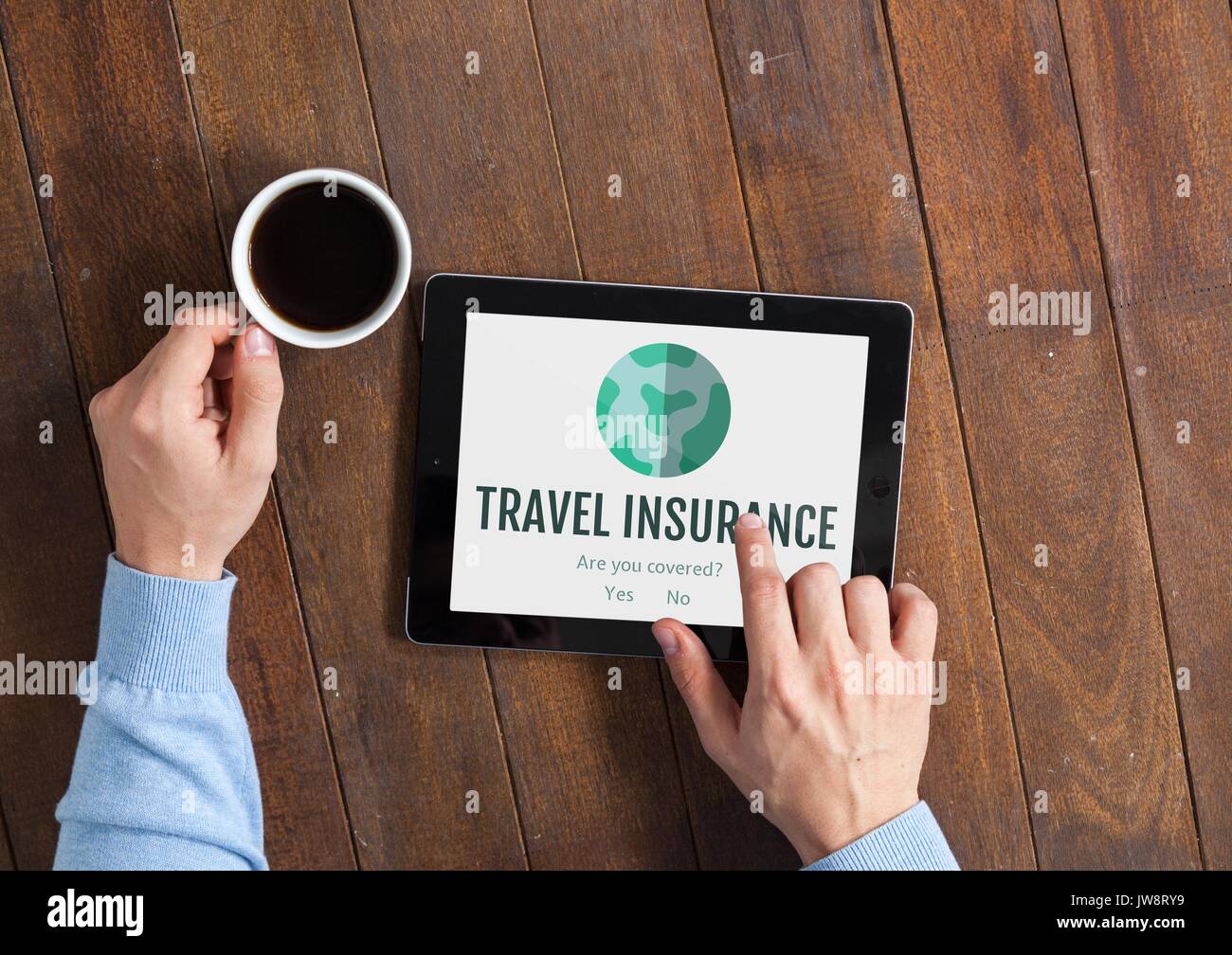 Digital composite of Man using a tablet with travel insurance concept ...