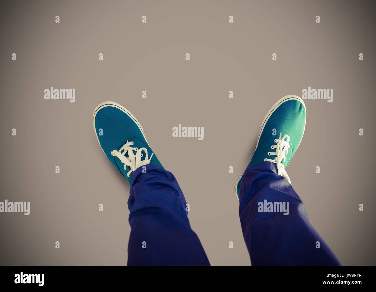 Digital composite of Green shoes on feet with brown background Stock ...