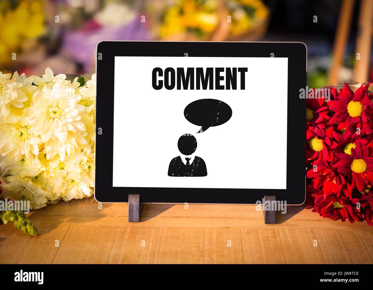 Digital composite of Comment text and chat graphic on tablet screen ...