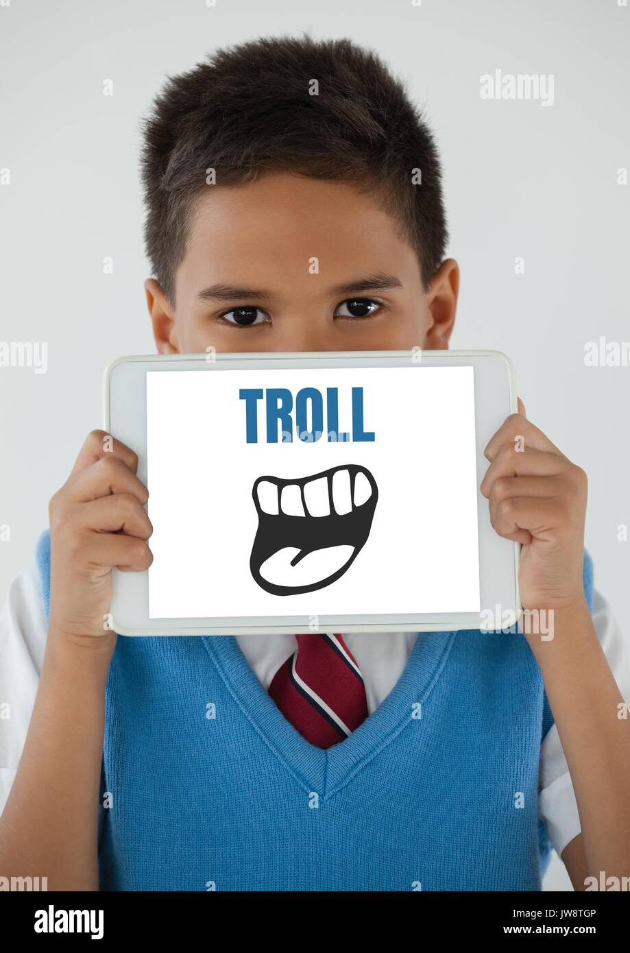 Digital composite of Troll text with cartoon mouth on tablet over boys ...
