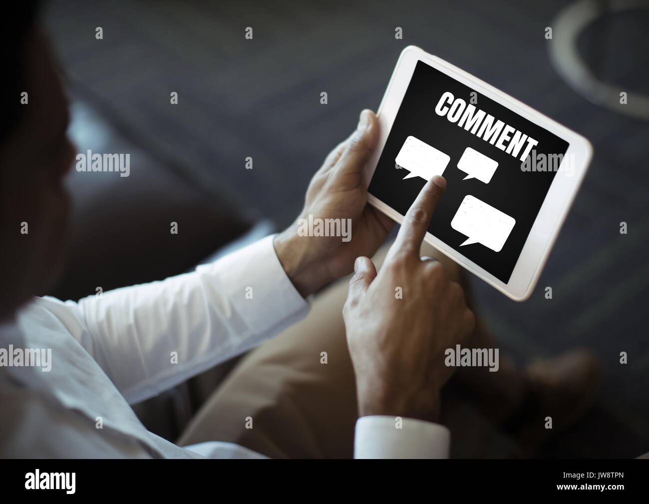 Digital composite of Comment text and chat graphic on tablet screen ...