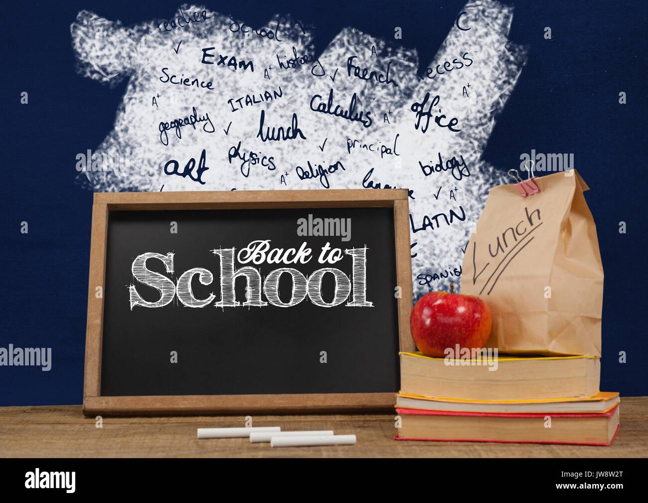 Digital composite of Back to school blackboard on Desk foreground with ...