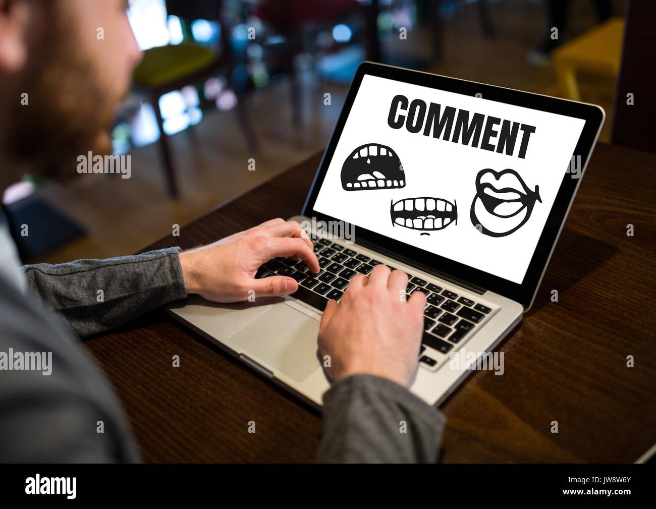Digital composite of Comment text and cartoon mouth graphic on laptop ...