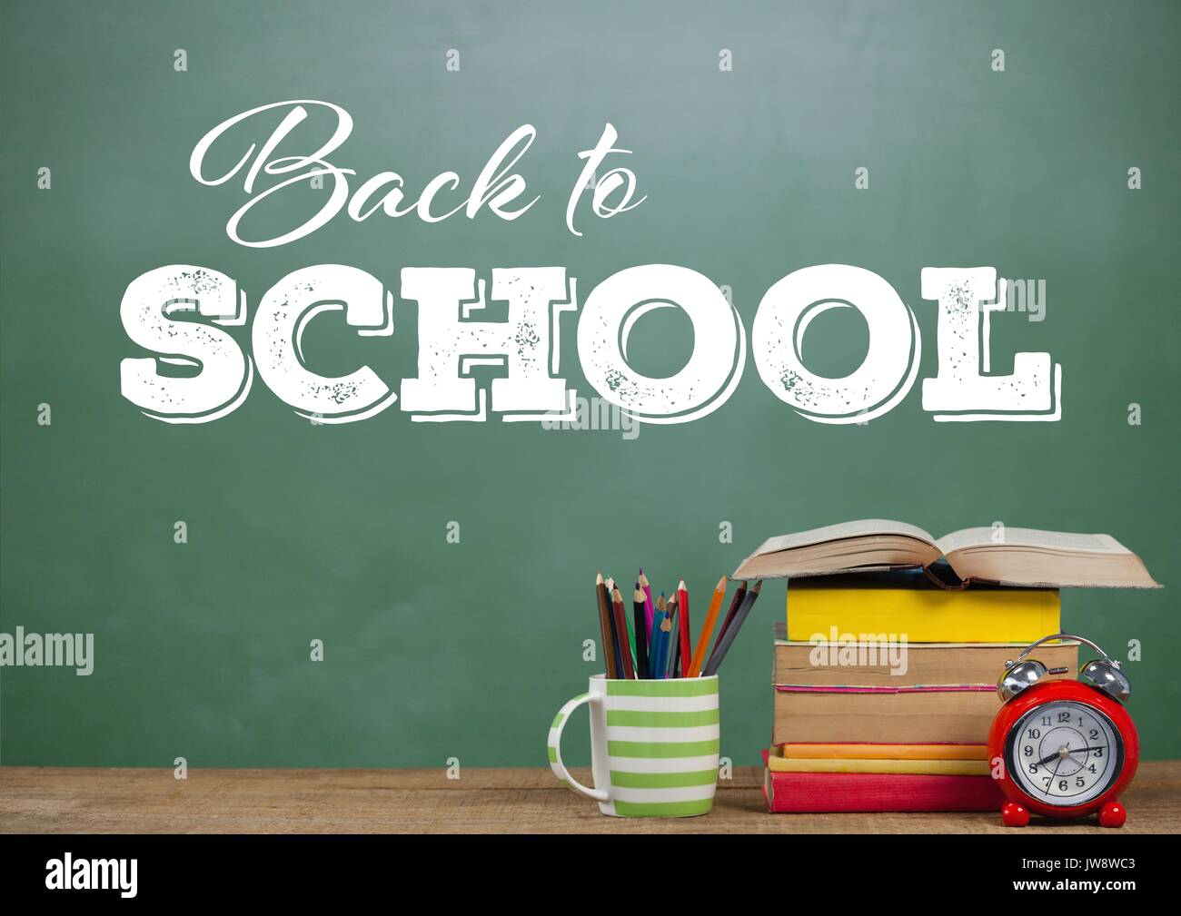 Digital composite of Books on Desk foreground with blackboard graphics ...