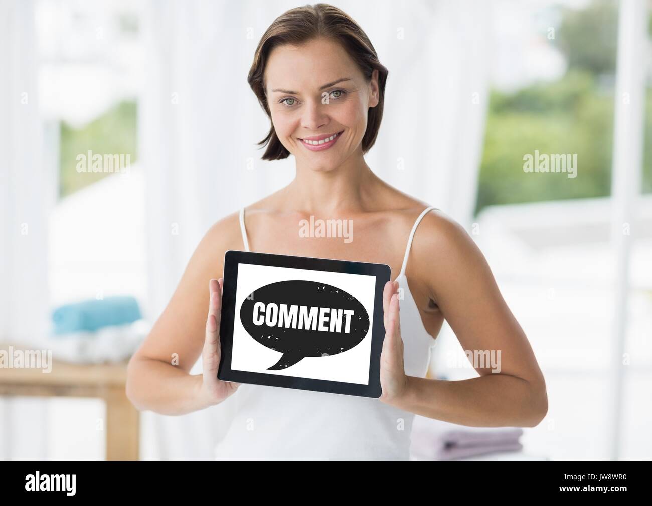 Digital composite of Comment text and chat graphic on tablet screen ...
