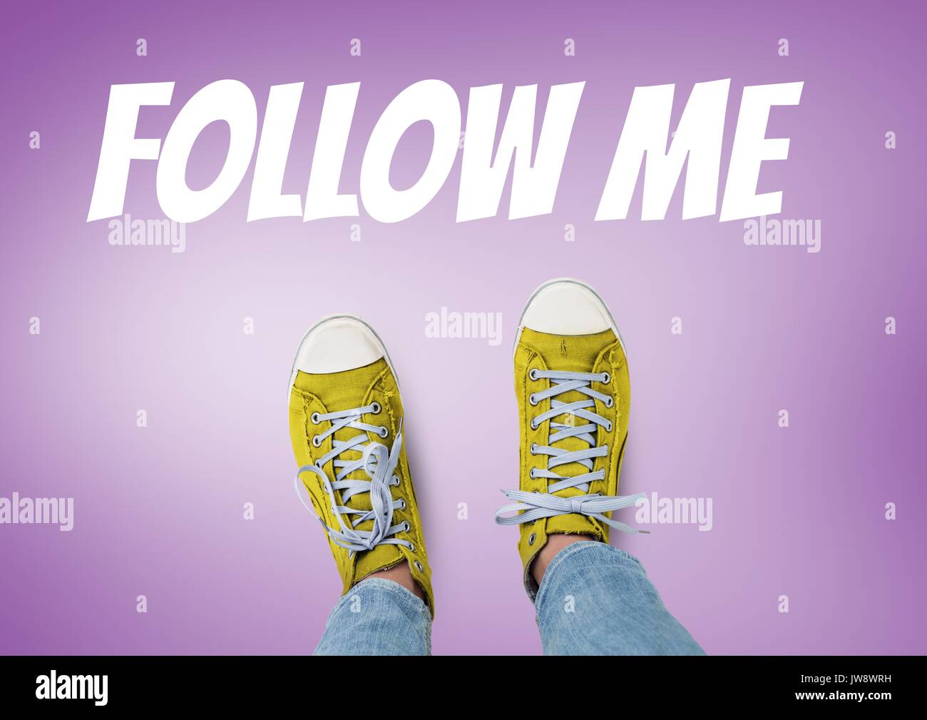 Digital composite of Follow me text and Yellow shoes on feet with ...