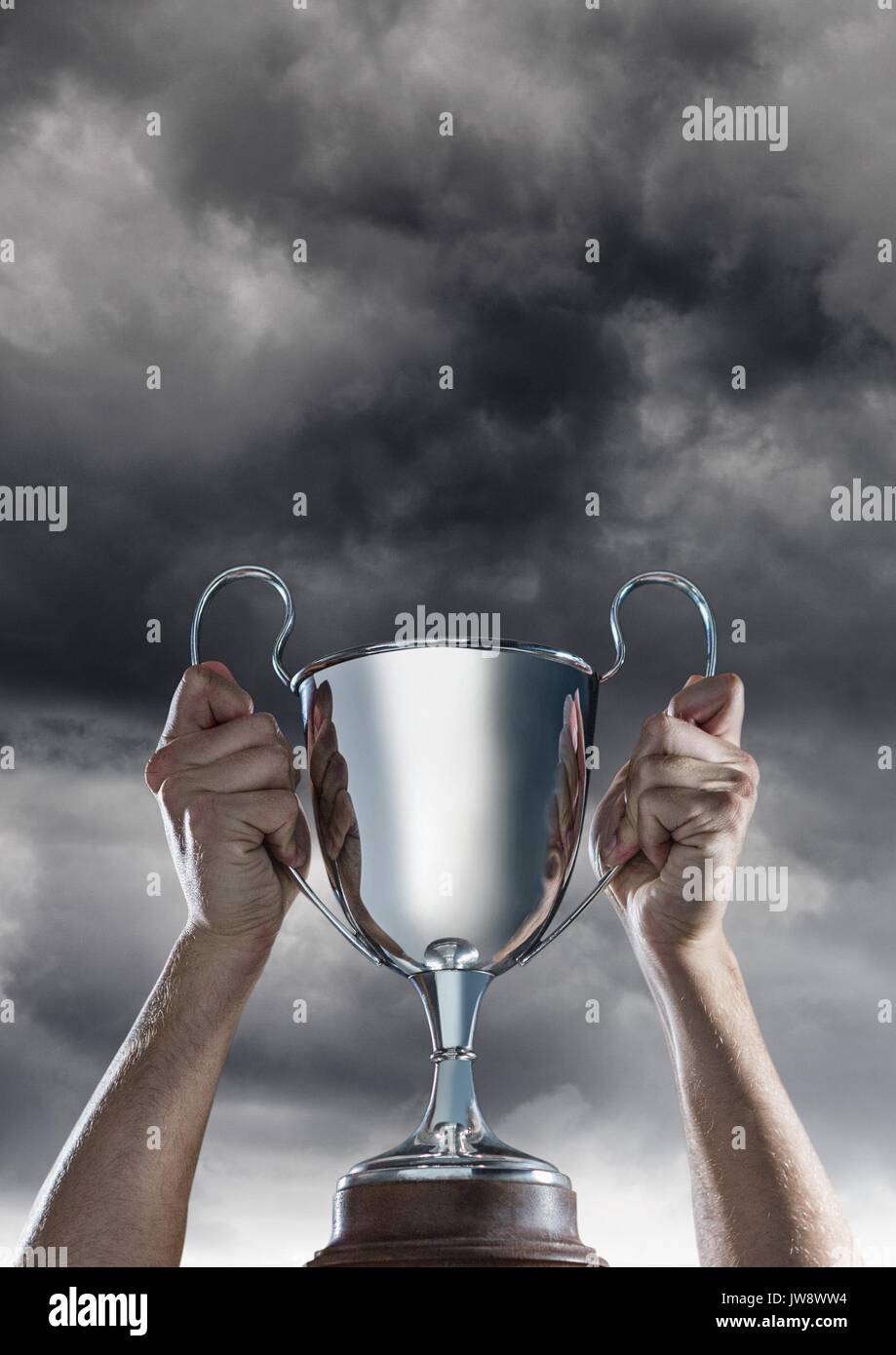 Raised hands man holding trophy hi-res stock photography and images - Alamy
