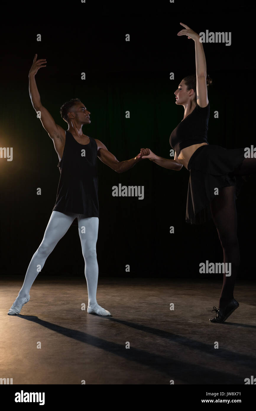 Ballet partners practicing ballet dance in stage Stock Photo - Alamy