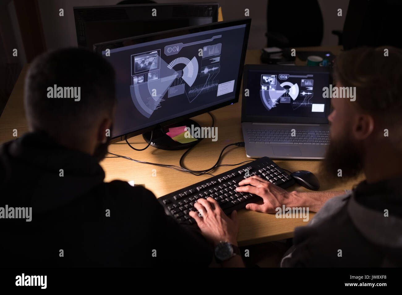 Executive working on personal computer at desk in office Stock Photo ...