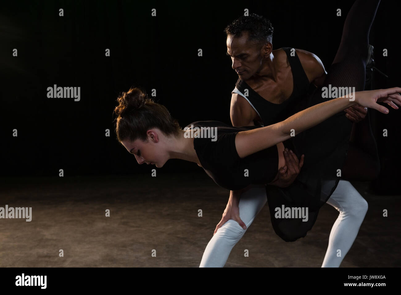 Ballet partners practicing ballet dance in stage Stock Photo - Alamy