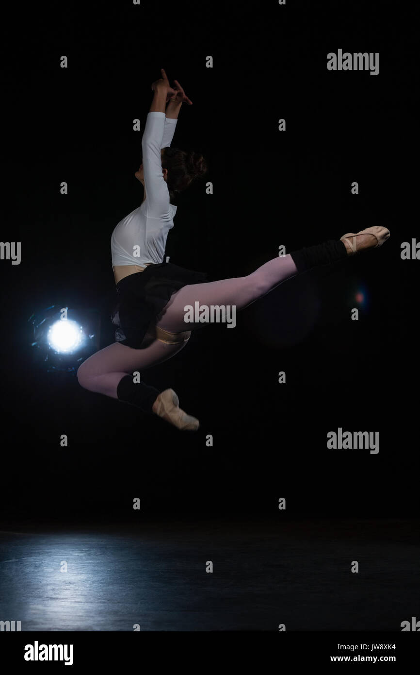 Focused ballet dancer leaping in the dance studio Stock Photo - Alamy