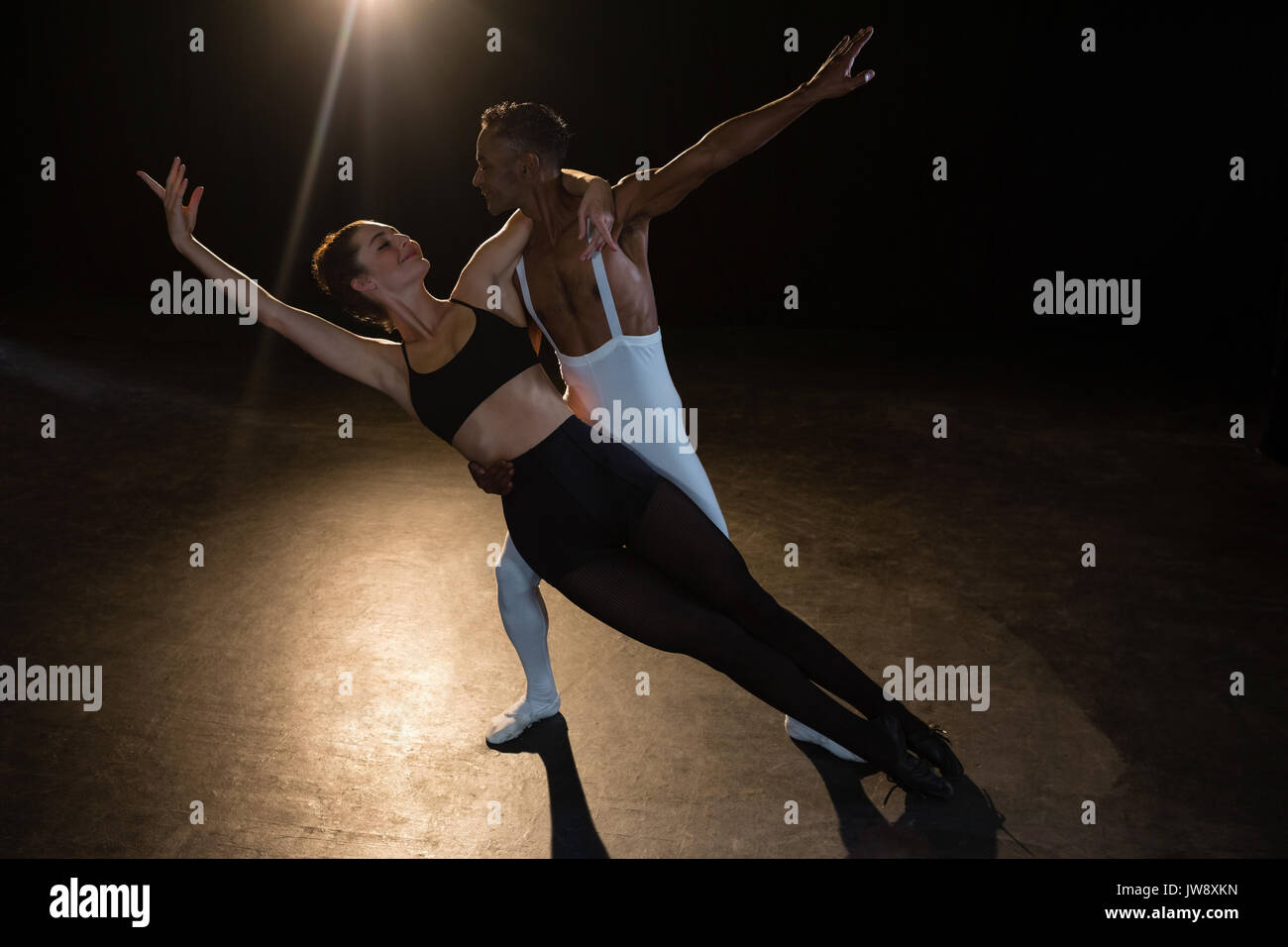 Ballet partners practicing ballet dance in stage Stock Photo - Alamy