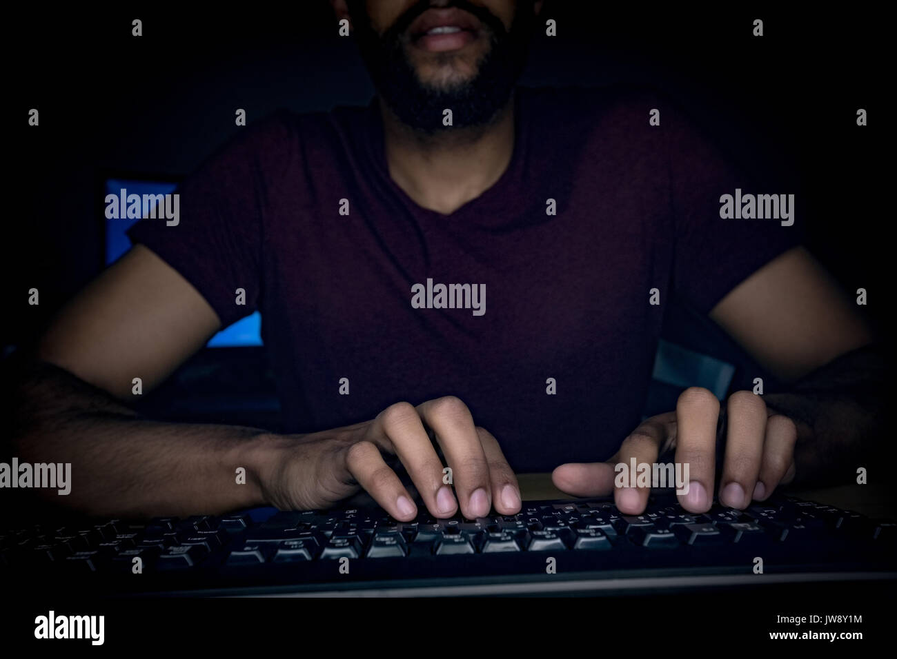 Mid section of executive typing on keyboard at desk in office Stock ...
