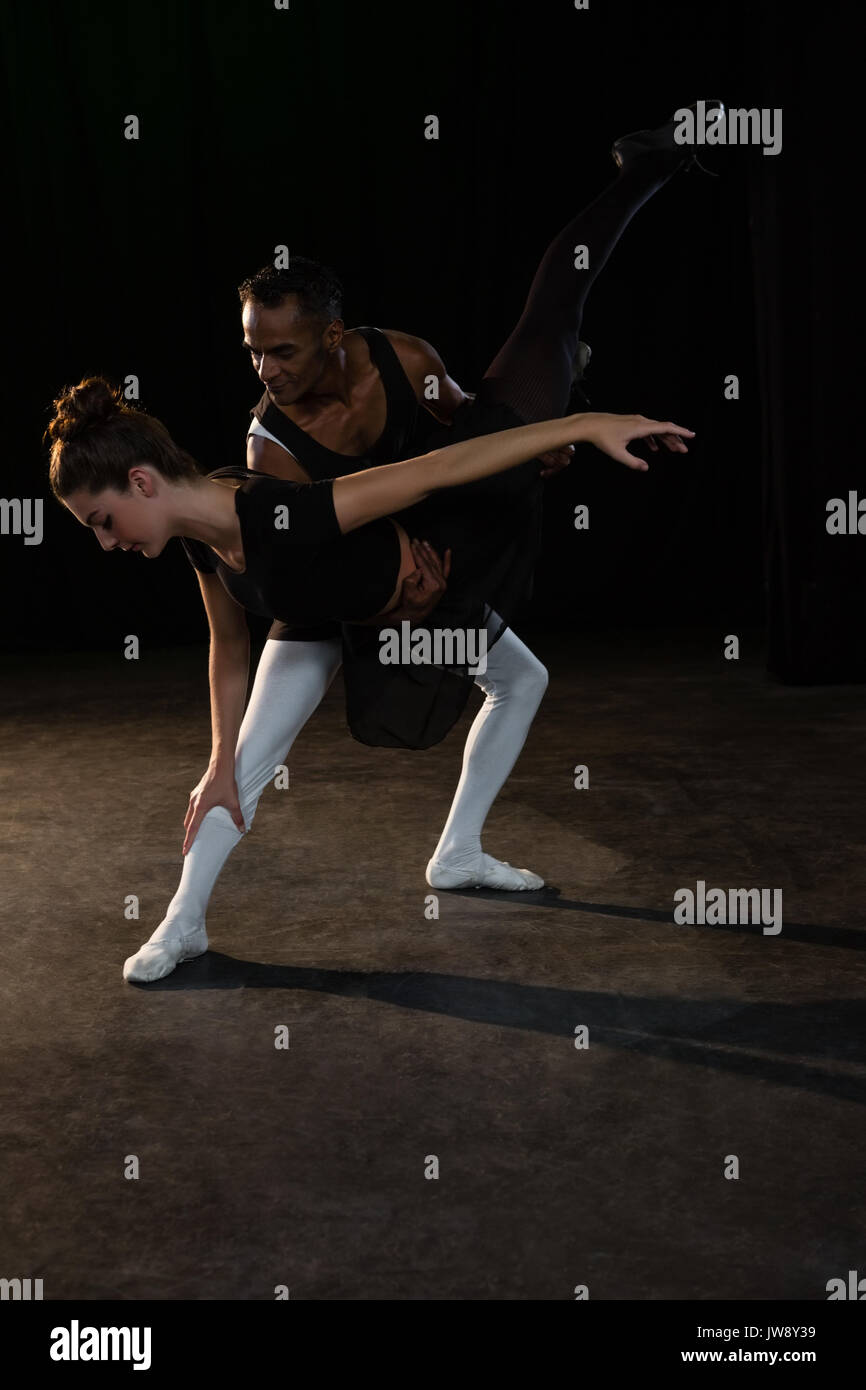 Ballet partners practicing ballet dance in stage Stock Photo - Alamy