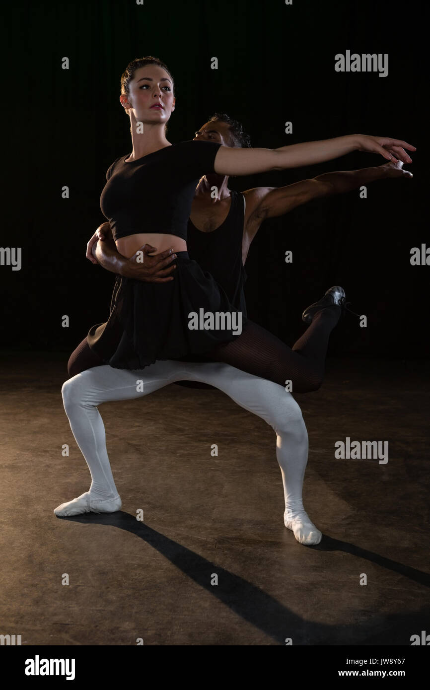 Ballet partners practicing ballet dance in stage Stock Photo - Alamy