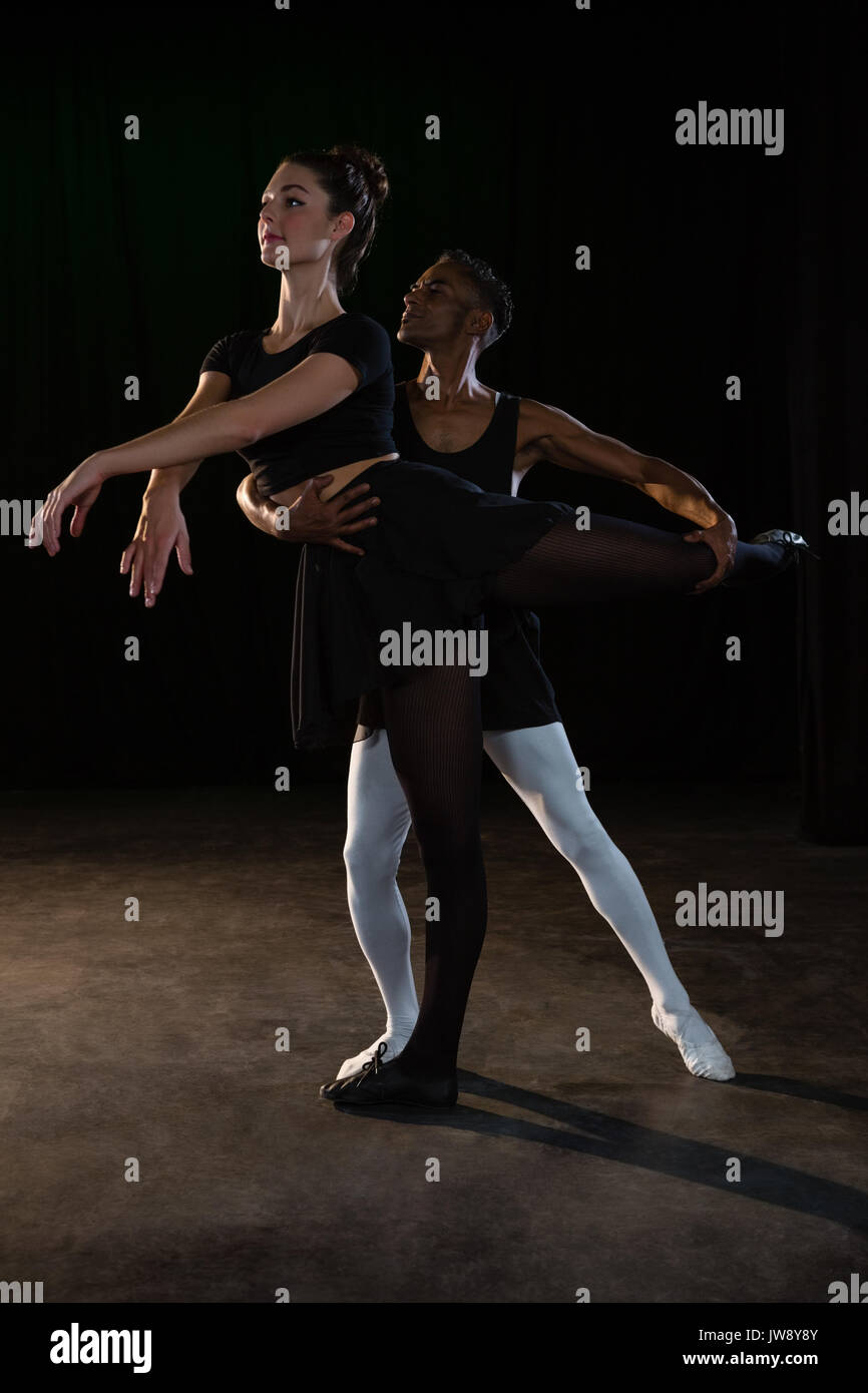 Ballet partners practicing ballet dance in stage Stock Photo - Alamy