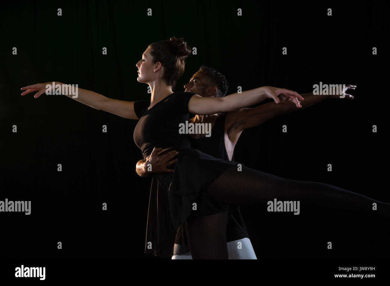 Ballet partners practicing ballet dance in stage Stock Photo - Alamy